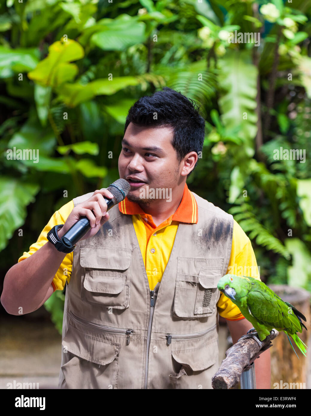A bird trainer addresses the crowd before a bird show at the KL Bird ...