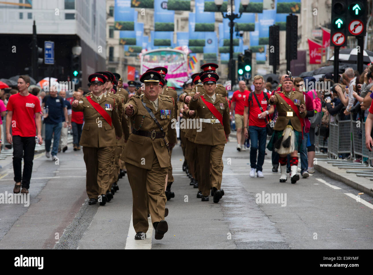 London, UK. 28th June 2014. Armed forces representatives join thousands ...