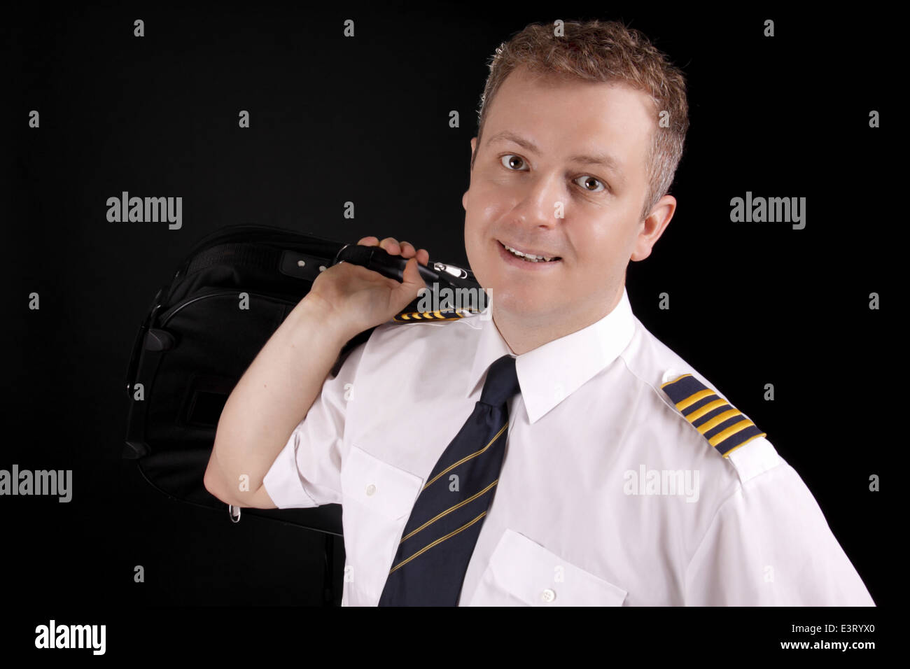 Cheerful captain in uniform on a black background Stock Photo - Alamy