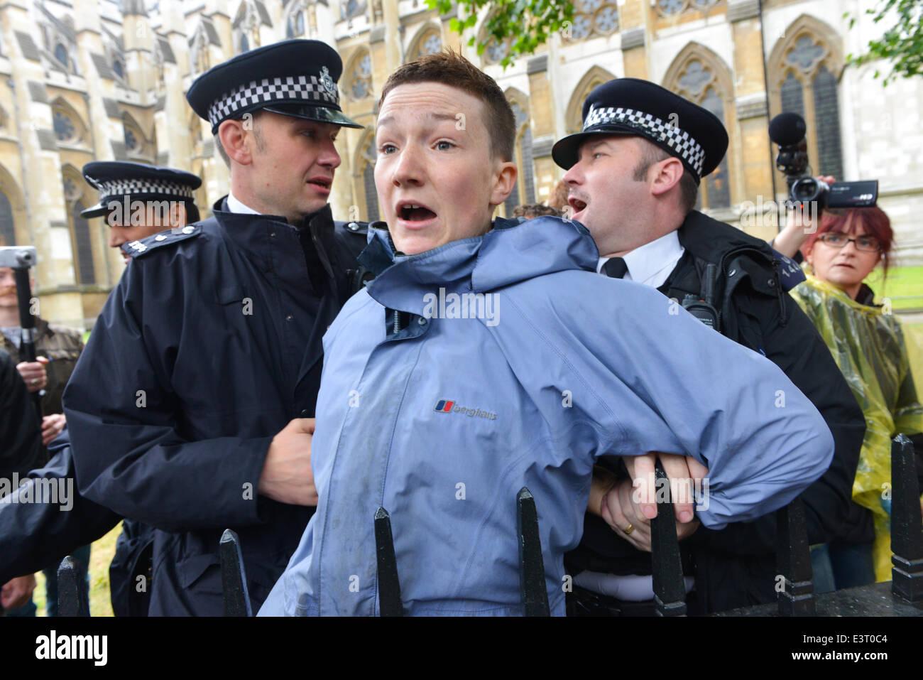 Westminster, London, UK. 28th June 2014. A woman is arrested by police ...
