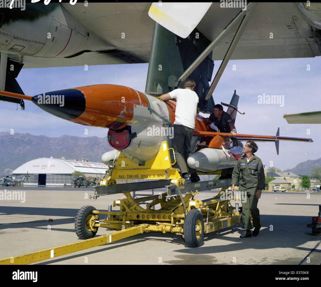This photo depicts a Lockheed C-130 Hercules aircraft and a DC-130 ...