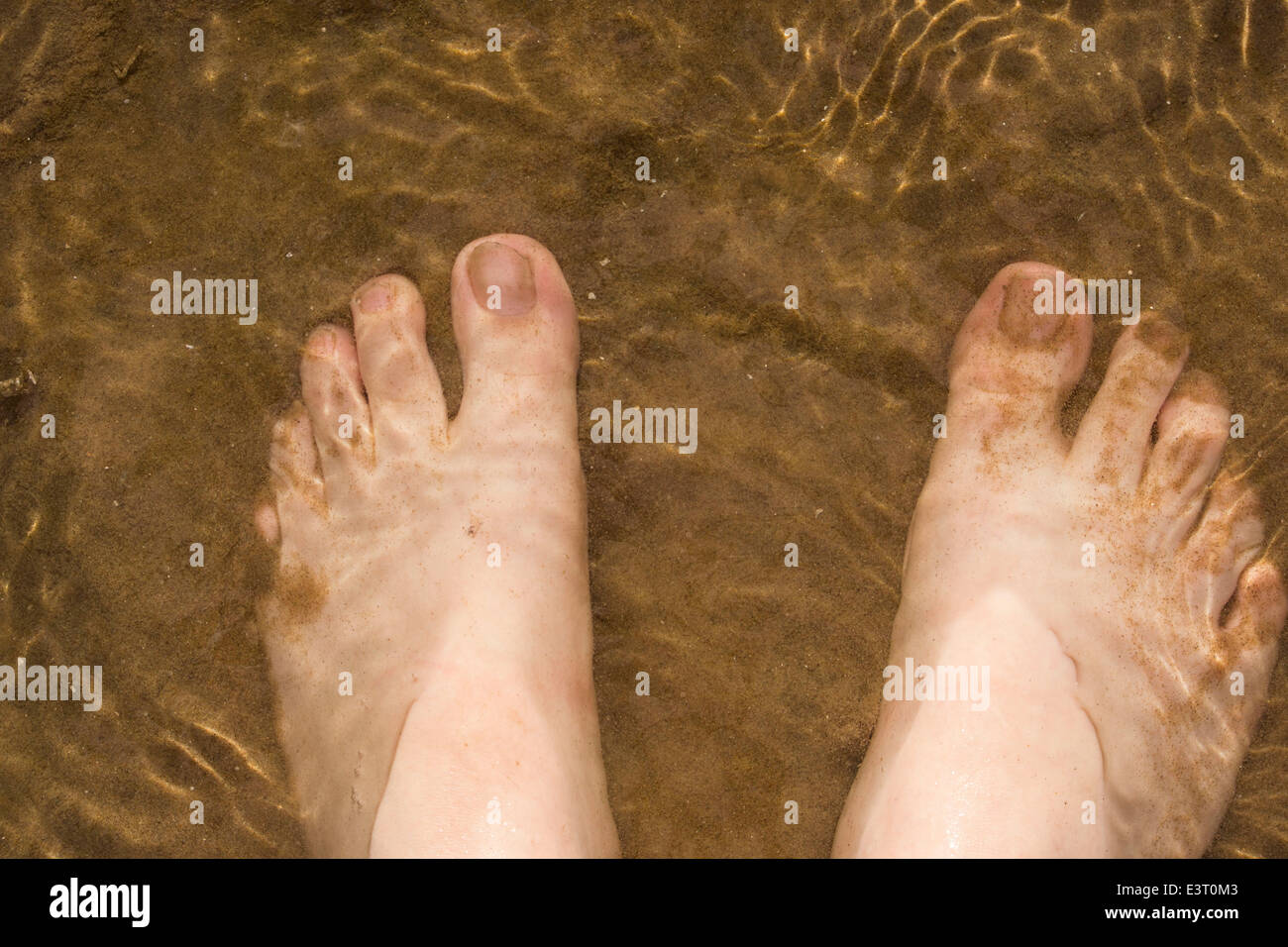 Female feet in sand hi-res stock photography and images - Alamy