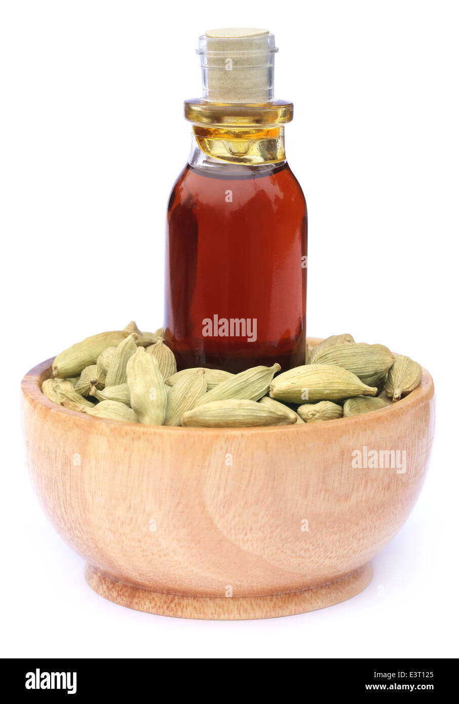 Cardamom with oil over white background Stock Photo - Alamy