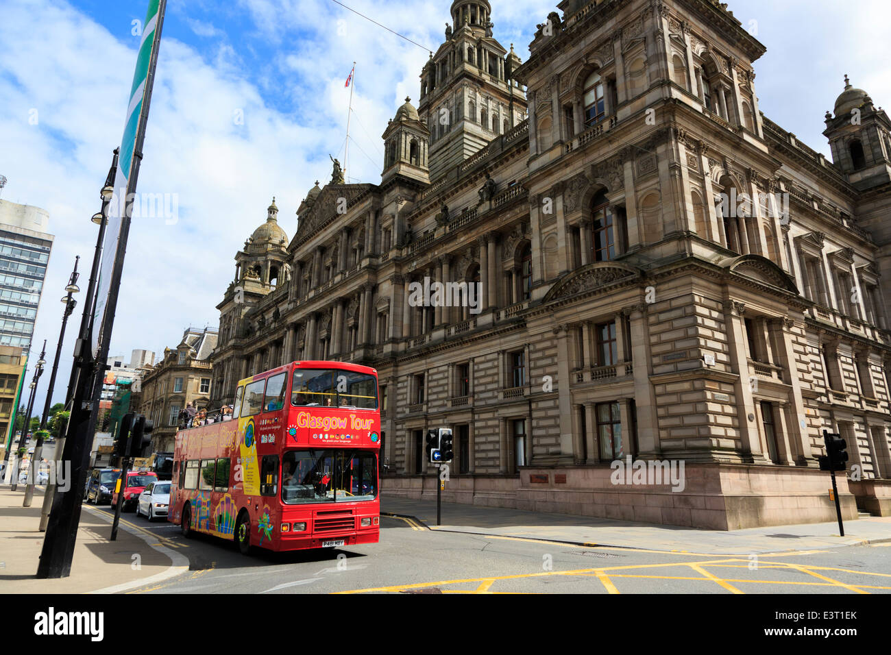 Glasgow city tour bus for tourists and visitors driving at the front of ...