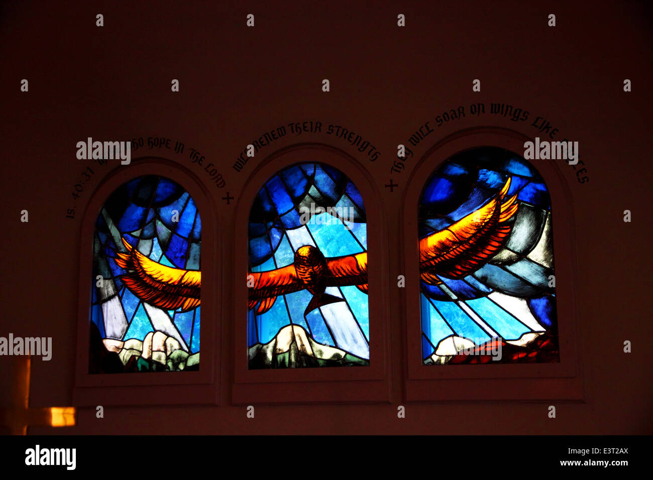 Three stained glass windows in a church depicting a flying eagle Stock ...