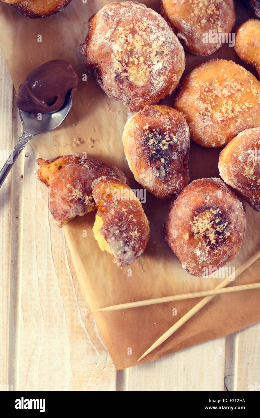 Sweet mini donuts from above on the wooden table Stock Photo - Alamy