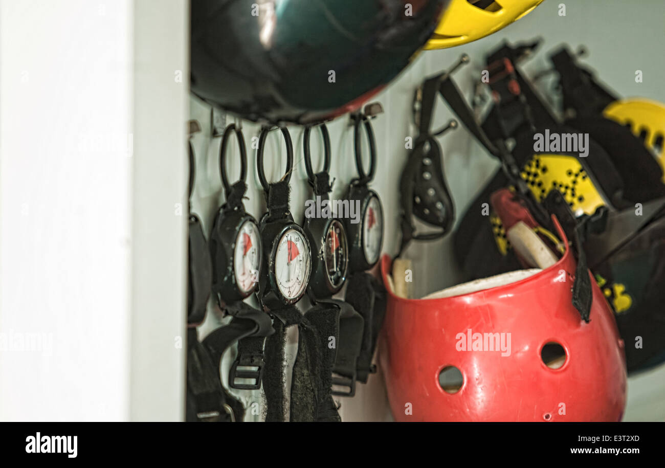 Several altimeters and helmets used for skydiving ready to use Stock ...