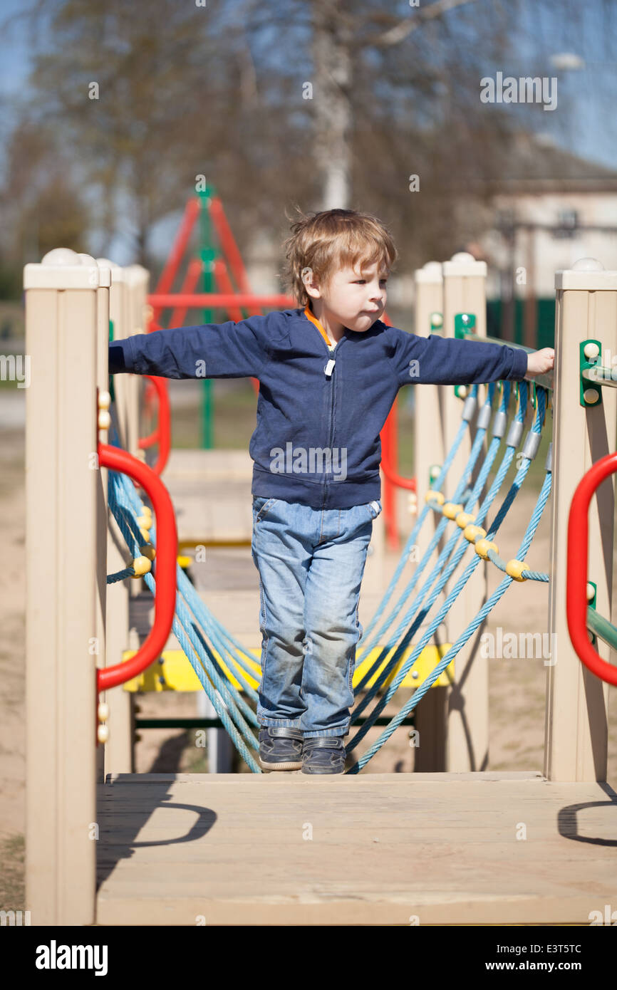 Young boy in the playground Stock Photo - Alamy