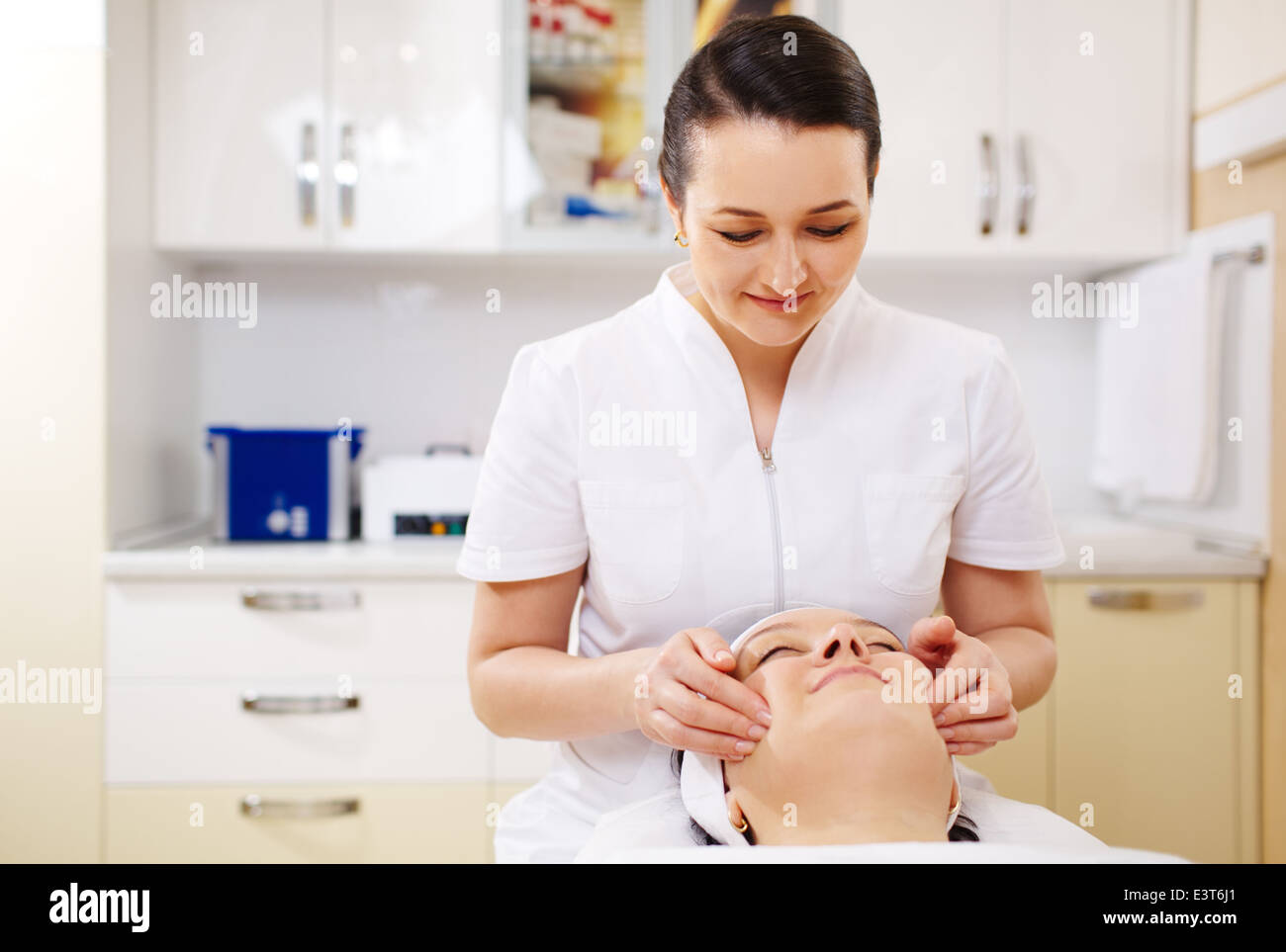 Professional beautician during seance hi-res stock photography and ...