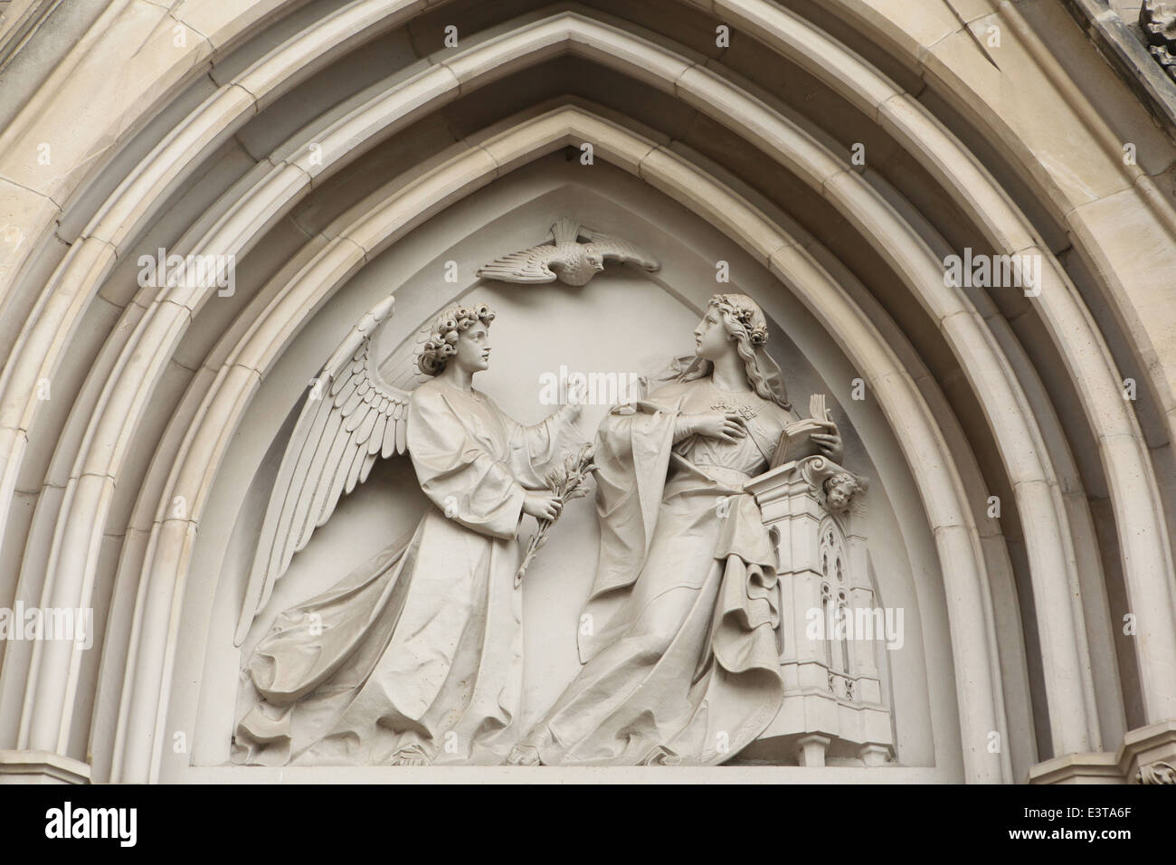 The Annunciation. Neo-Gothic relief over the main gate of Saint ...