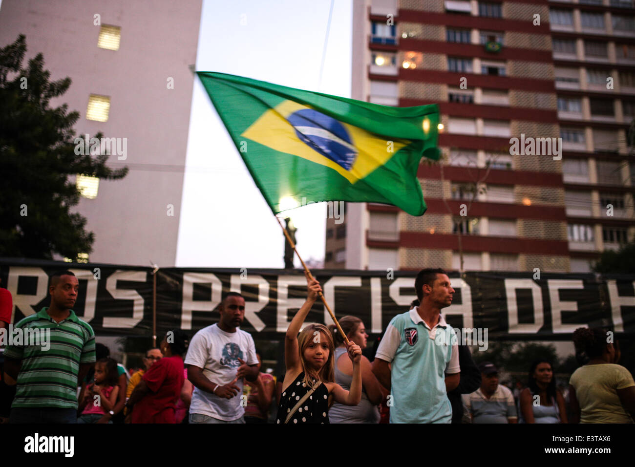 Sao Paulo, Brazil - June 26: A child girl waves a flag of Brazil during ...