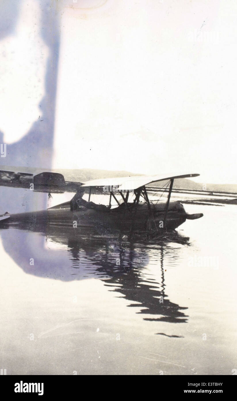 This photograph features a Waco 10 aircraft at Peiks Airport, with ...