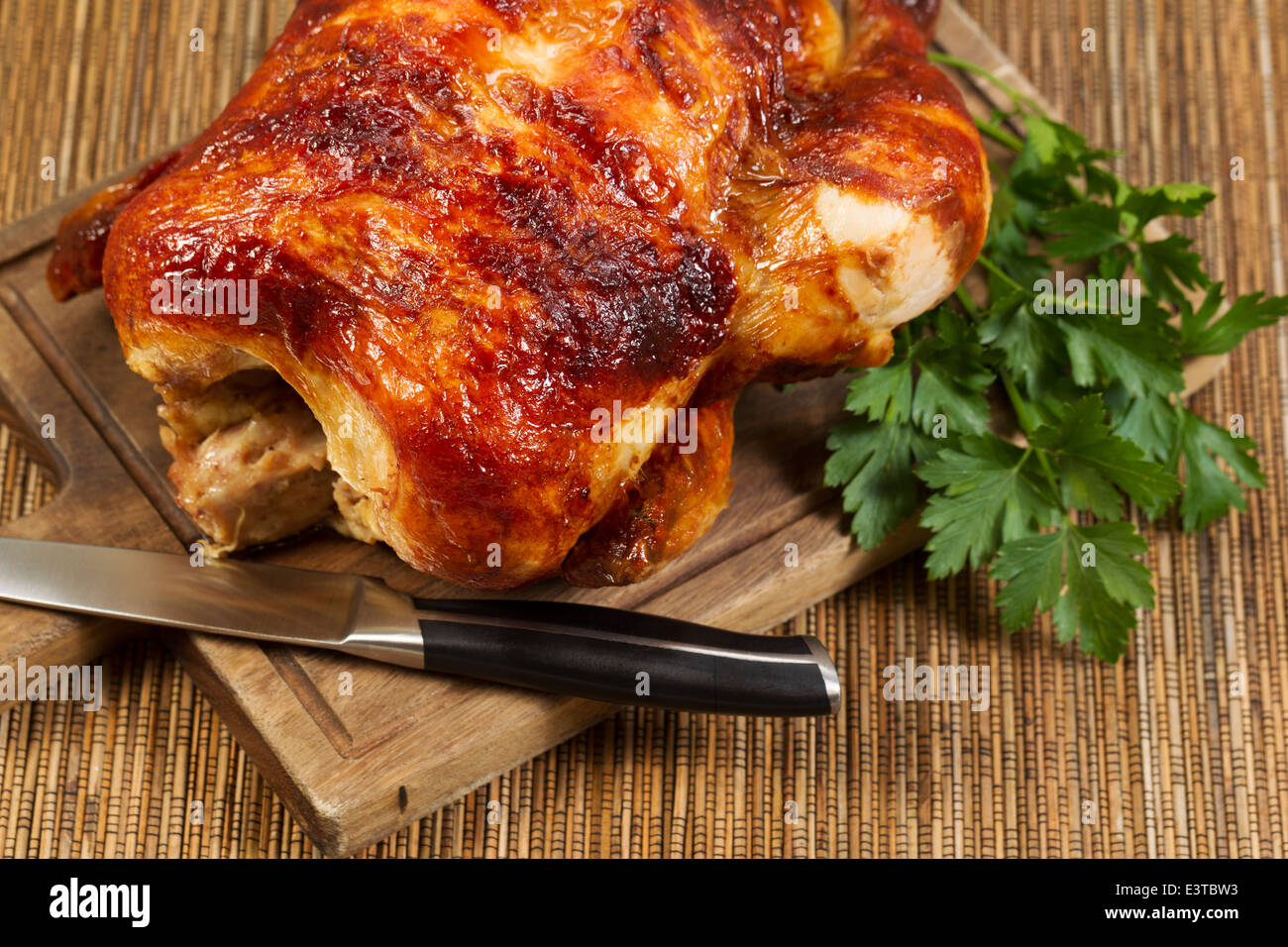 Horizontal photo of a freshly oven roasted Whole Chicken on traditional ...