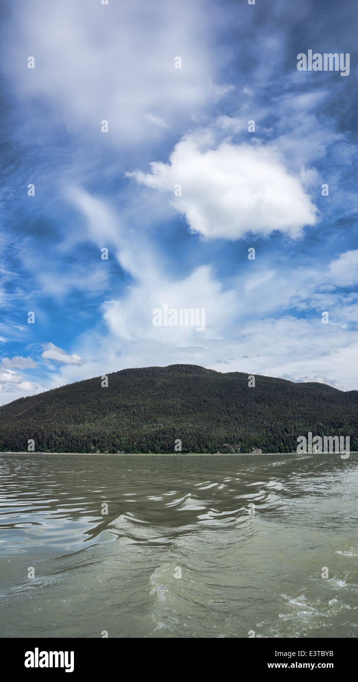 Clouds over the Chilkat Inlet in Southeast Alaska with silty water from ...