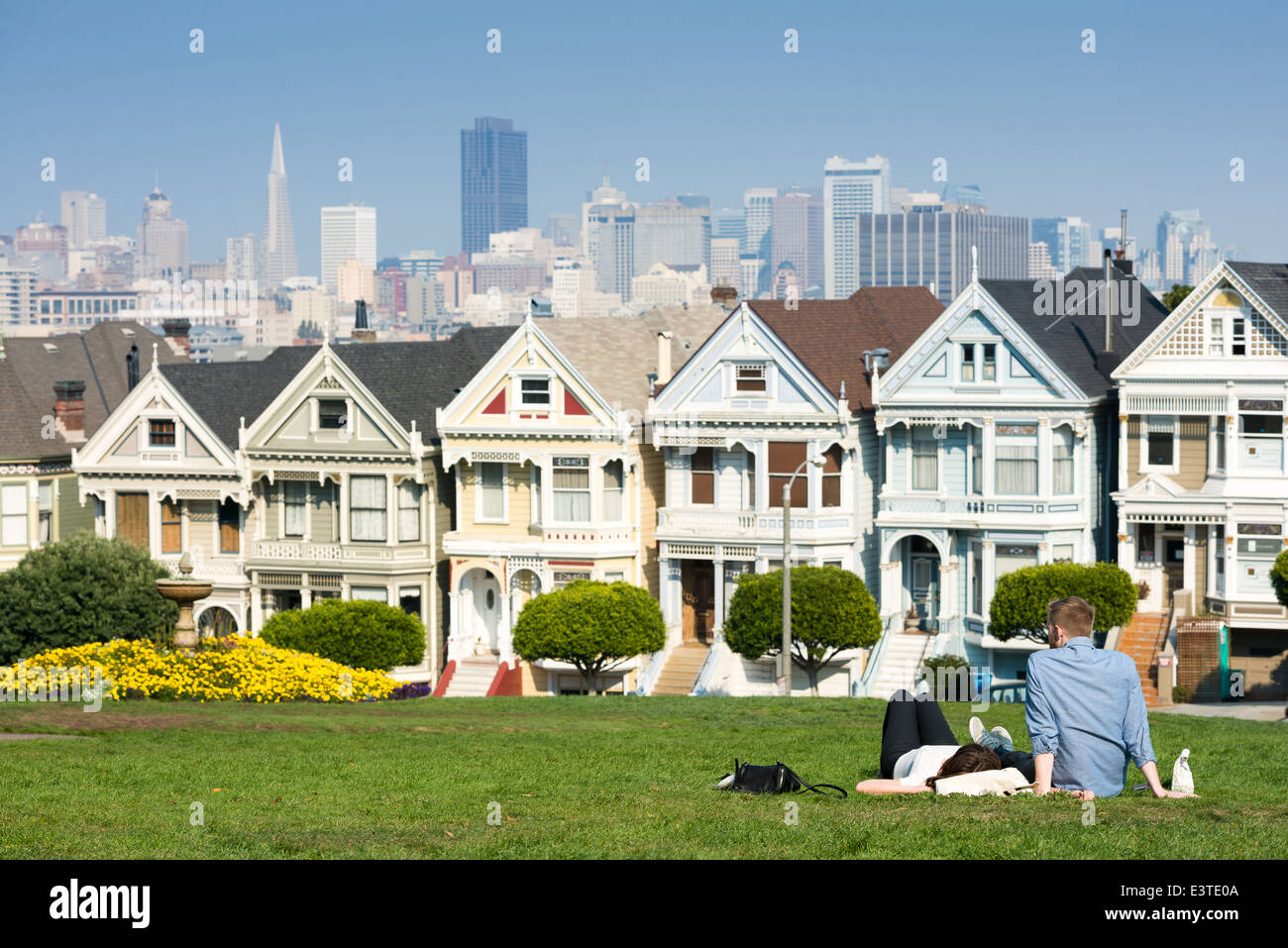 Painted ladies of Alamo Square, San Francisco with downtown are in ...