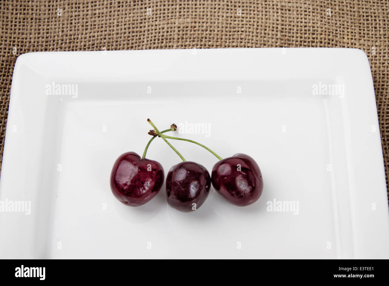 Dish of black cherries Stock Photo - Alamy