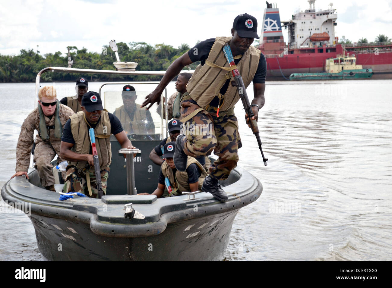 US Marines and Nigerian Army Soldiers prepare to land on a beach during ...