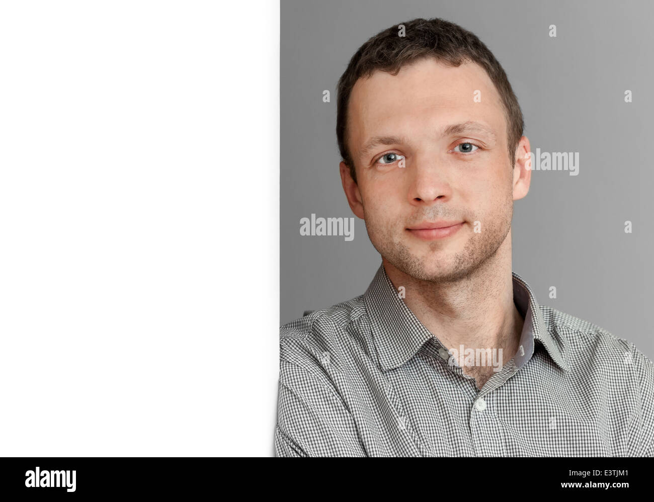 Young smart Caucasian Man, portrait with white wall Stock Photo - Alamy