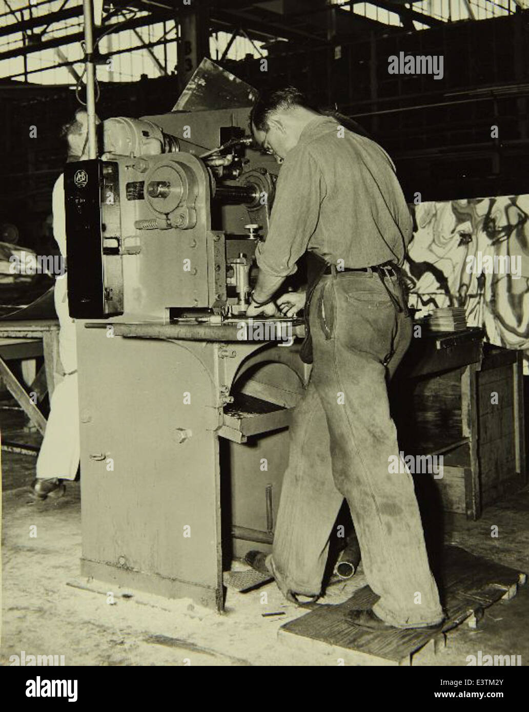This image shows scenes from the Consolidated/Convair aircraft factory ...