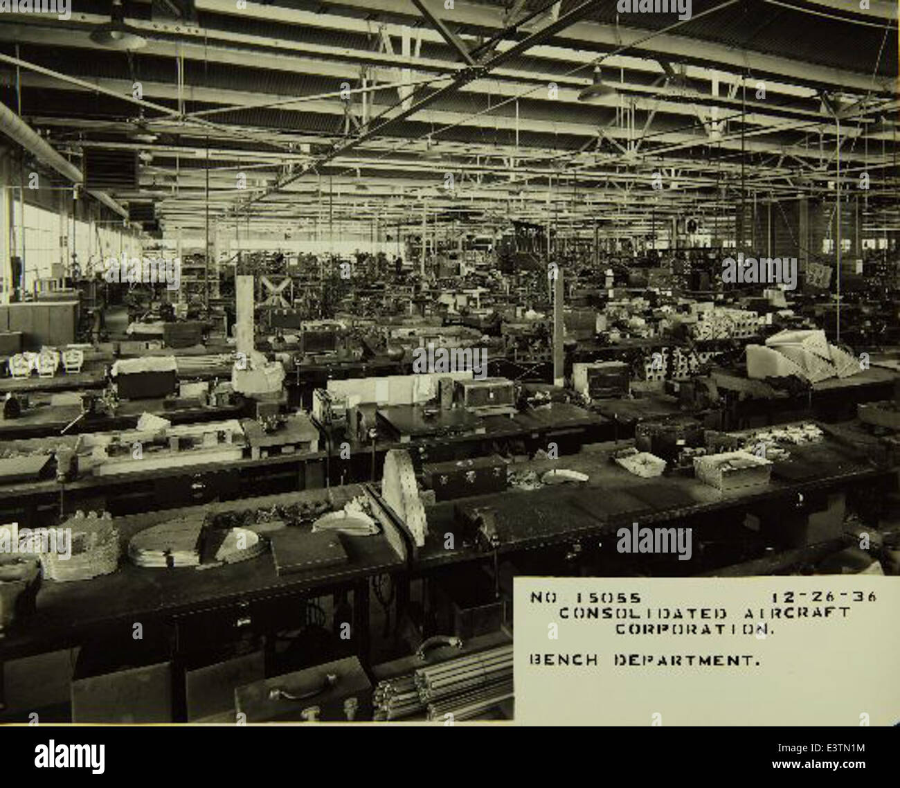 The image depicts a machine shop within the Consolidated/Convair ...