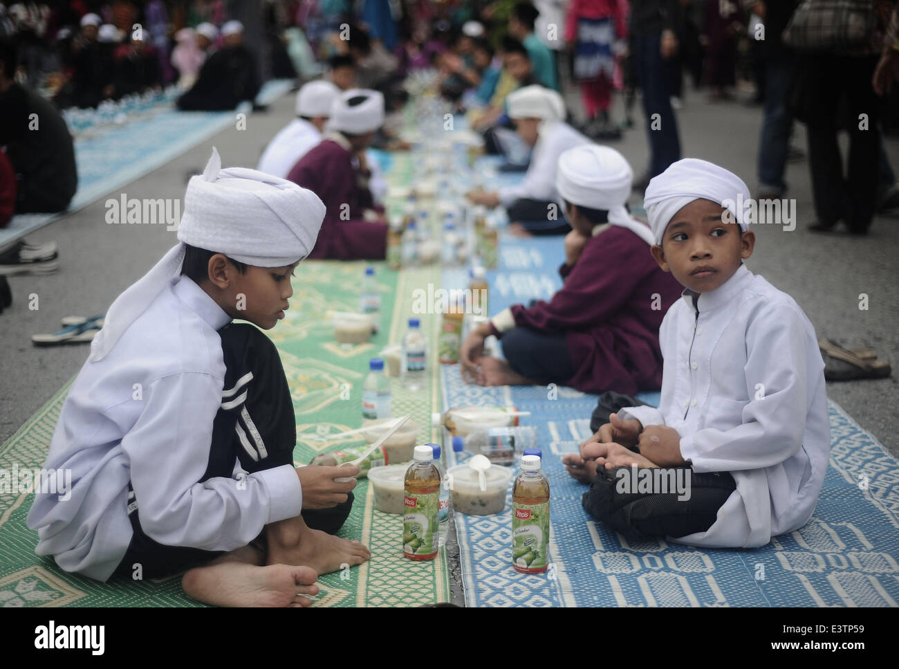 Kuala Lumpur, MALAYSIA. 29th June, 2014. Young Malaysian Muslim ...
