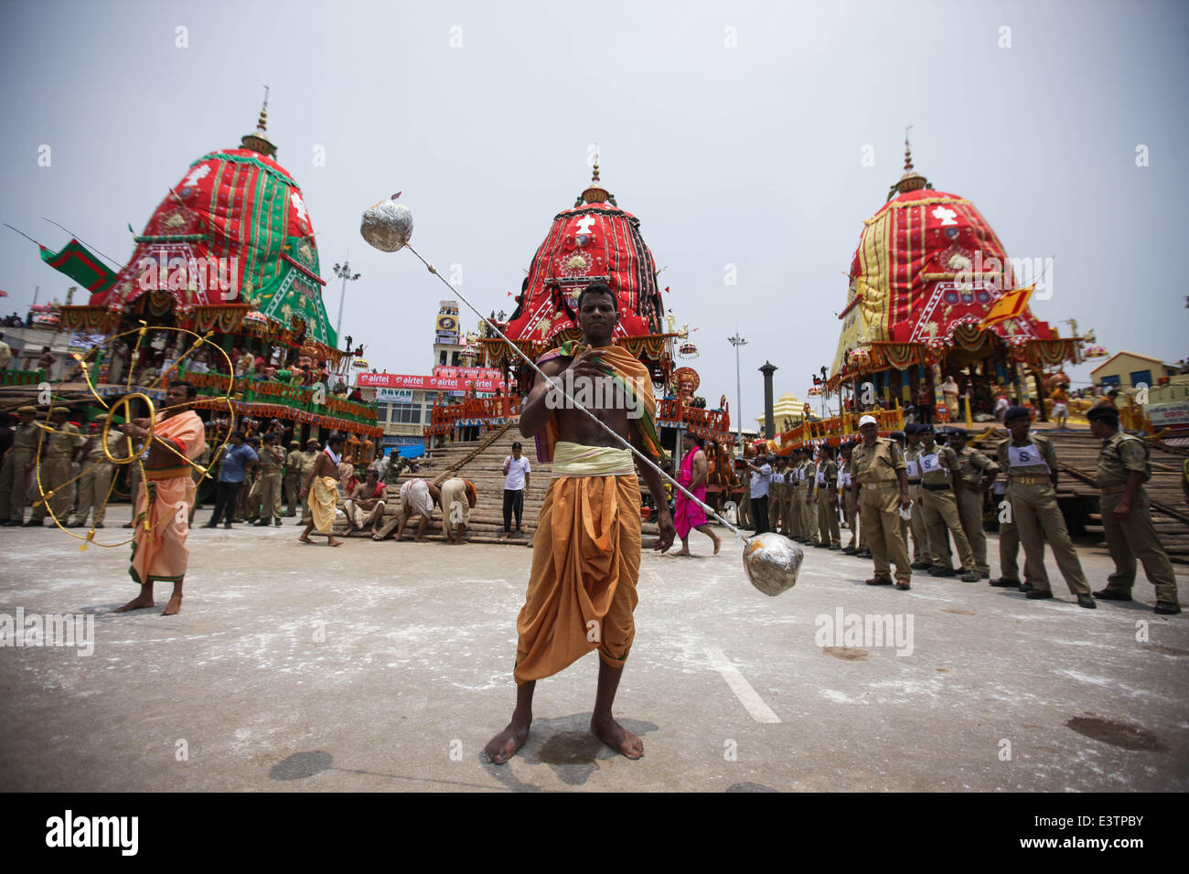 Puri, Orissa of India. 29th June, 2014. Hindu devotees perform in front ...