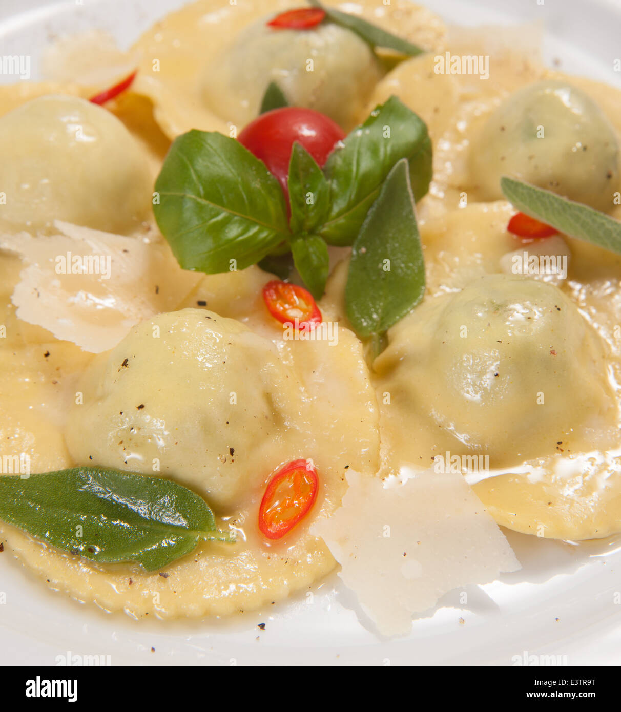 Ravioli with red chily pepper and sweet basil Stock Photo - Alamy