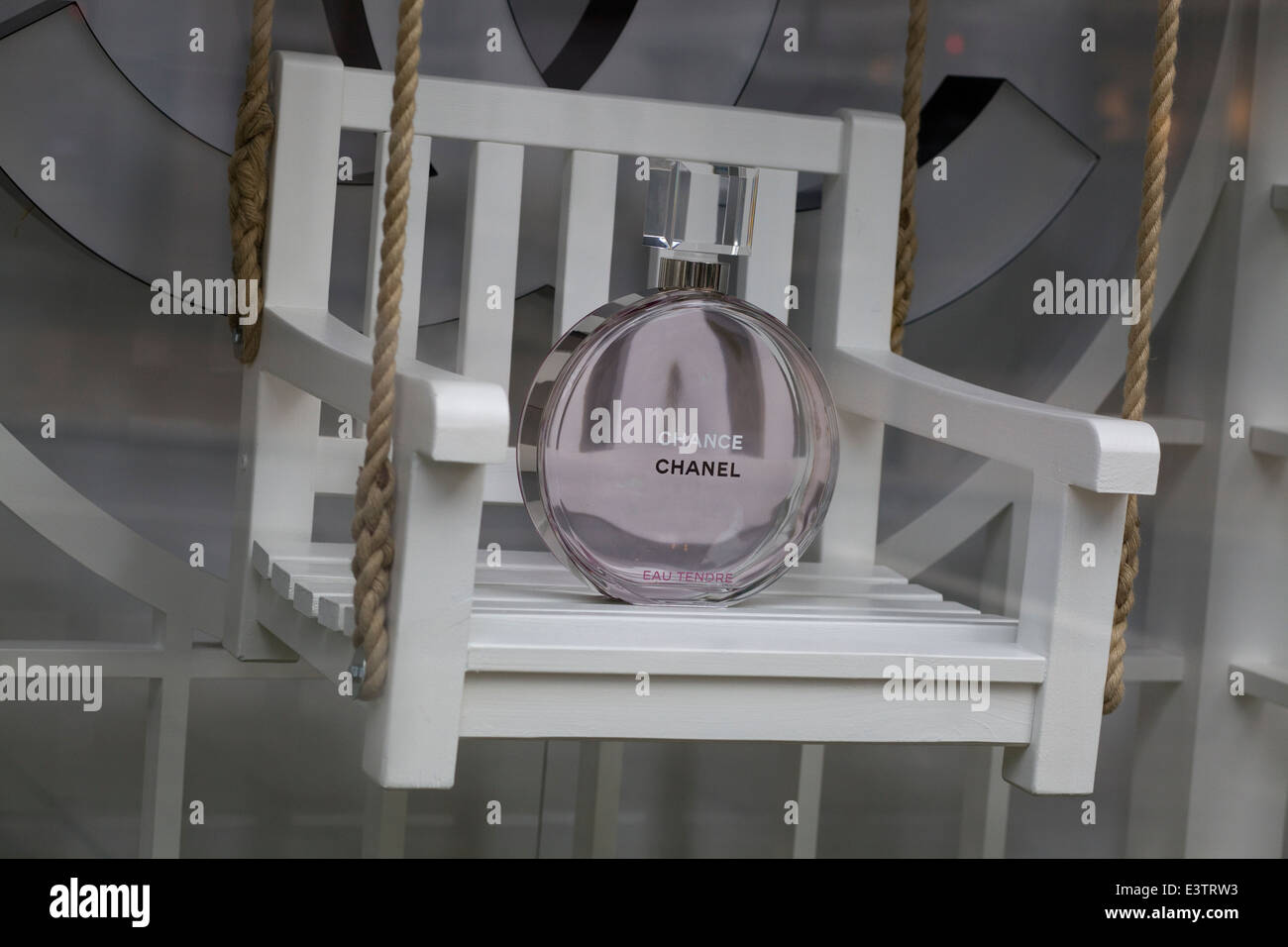 Chanel perfume on a wooden swing for a Shop window Display Stock Photo ...