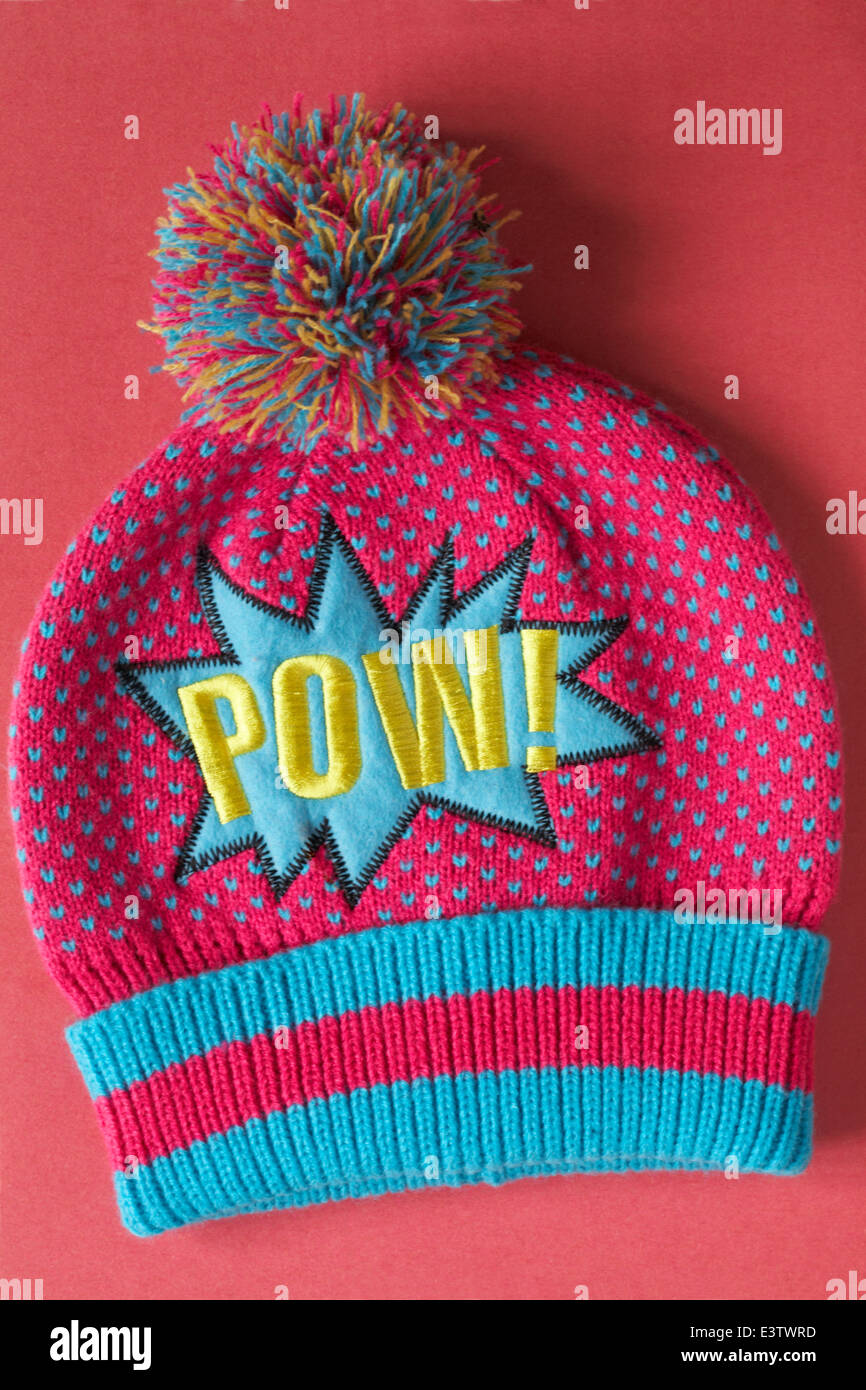 pink and blue POW hat with pompom set on pink background Stock Photo ...