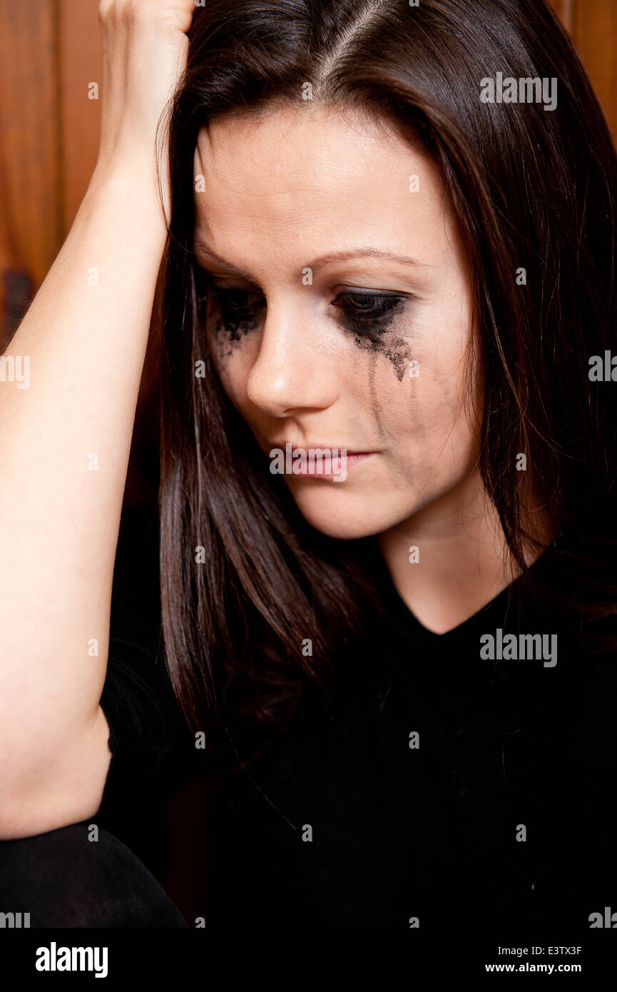 Tearful young woman with her make-up running down her face Stock Photo ...