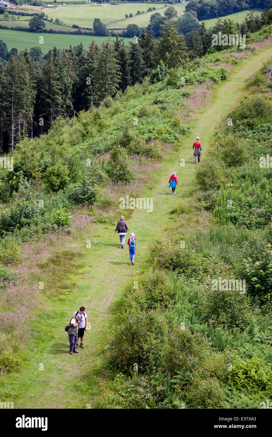 Walkers wandering along the ridge path of Callow Hill, towards ...