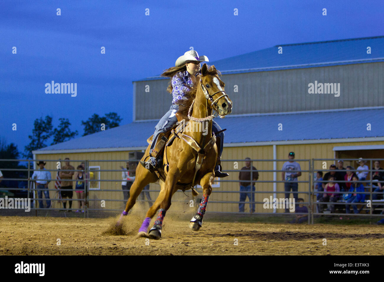 Female cowboy on horse (barrel racing event Stock Photo - Alamy