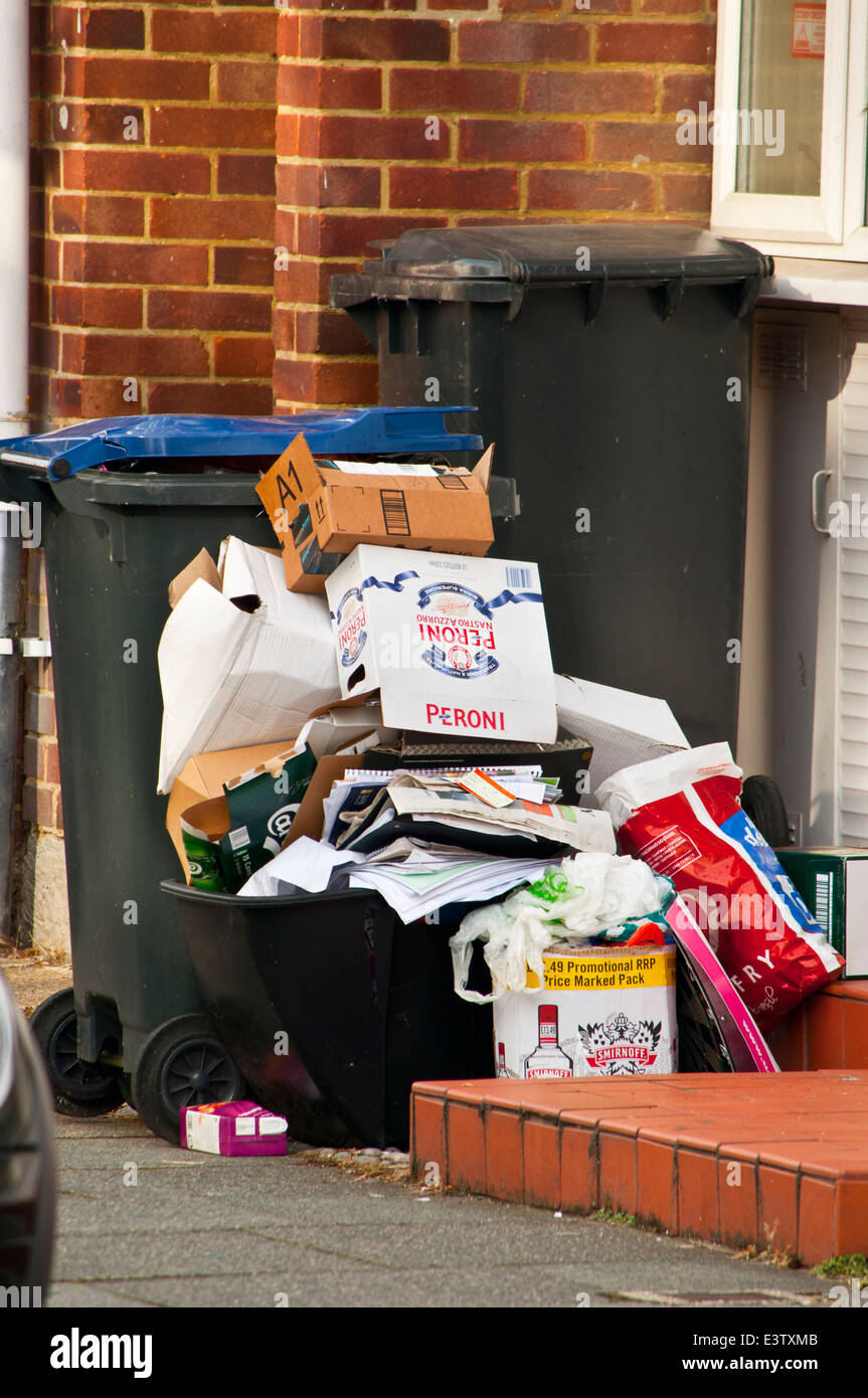 Cardboard recycling wheelie bin street Stock Photo - Alamy
