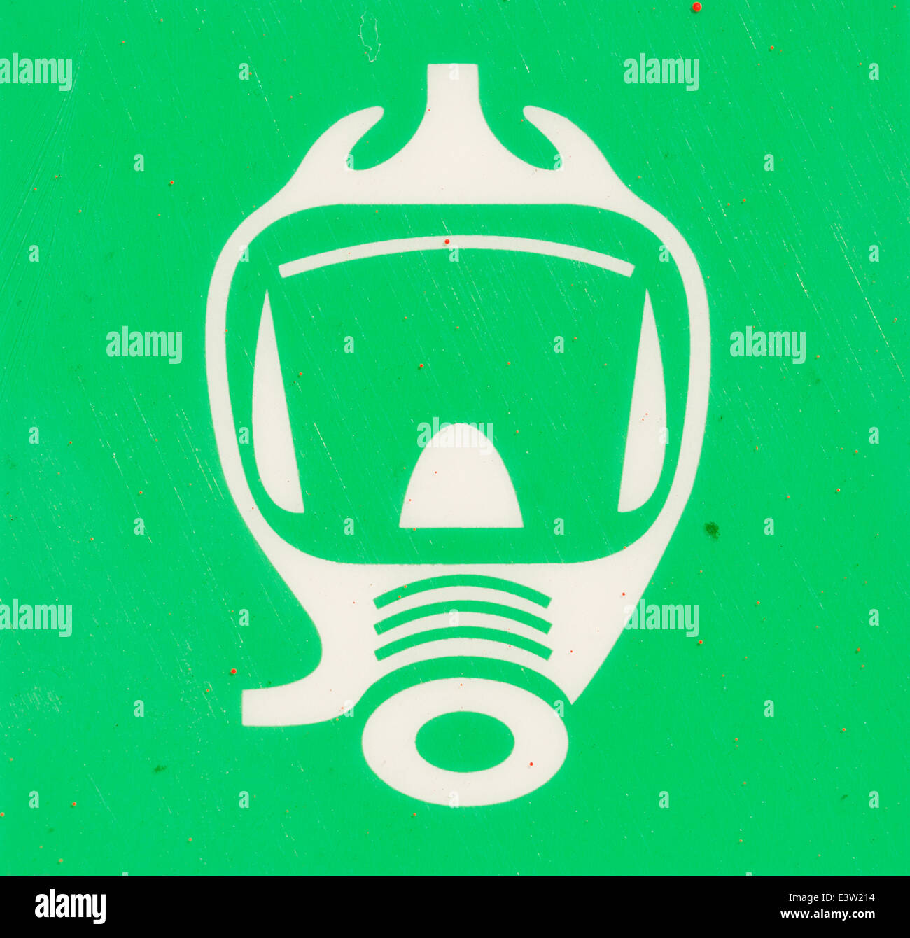 white gas mask sign on a green background Stock Photo - Alamy