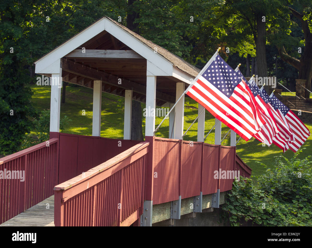 American flags on a covered footbridge Stock Photo - Alamy