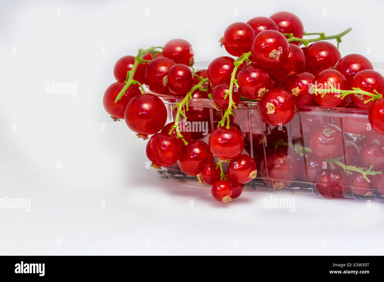 Red Current in plastic box from supermarket Stock Photo - Alamy
