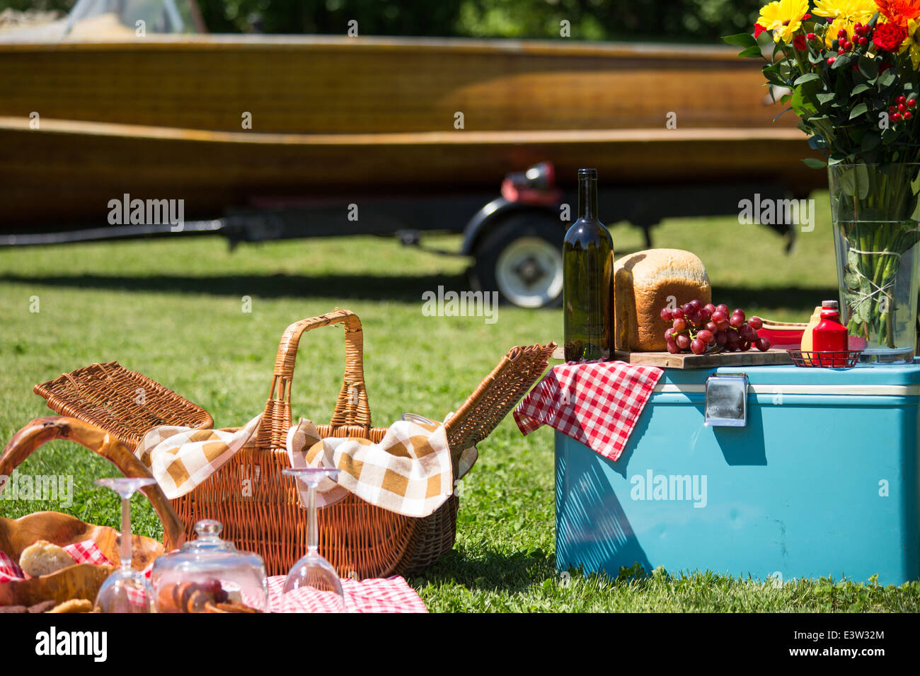 A vintage picnic at the lakehouse with a vintage boat in the background ...