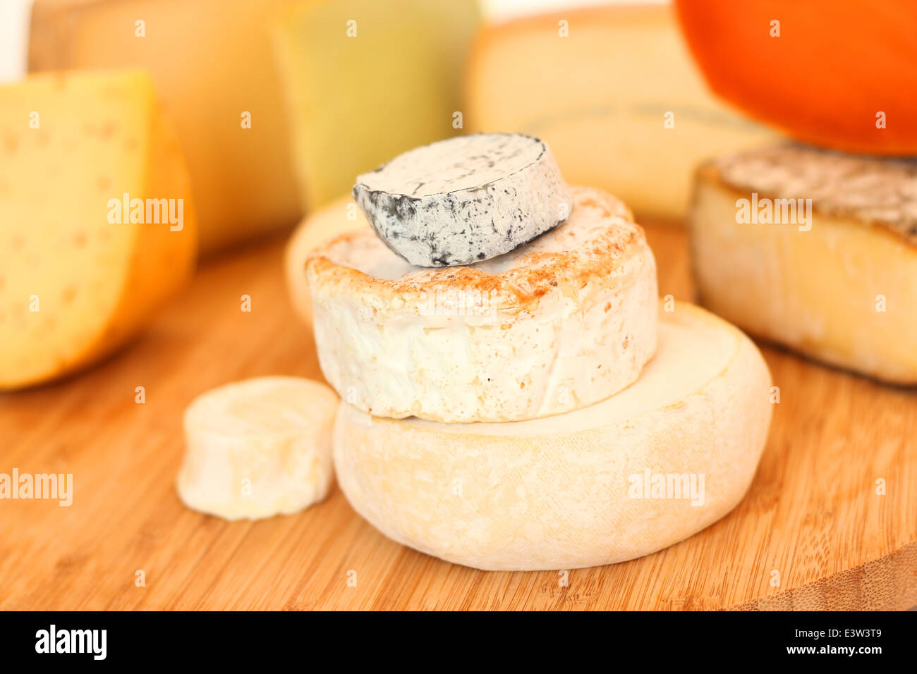 French cheese collection on wooden board with copy space Stock Photo ...