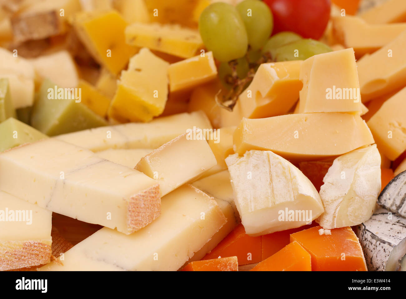 Cut french cheese blocks background close-up Stock Photo - Alamy