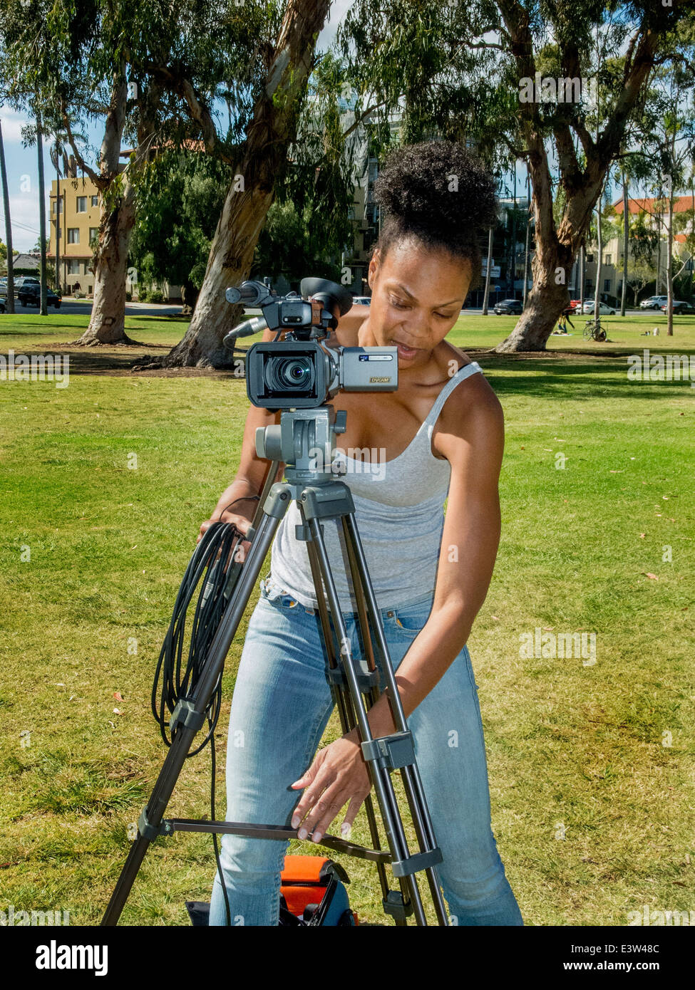 A young African American college communications student prepares to ...
