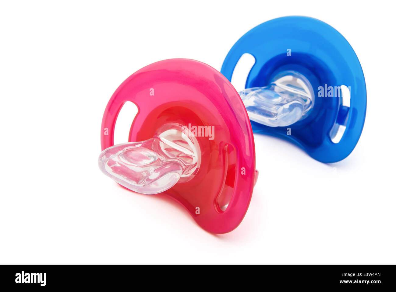 red and blue pacifiers isolated on white with clipping path Stock Photo ...
