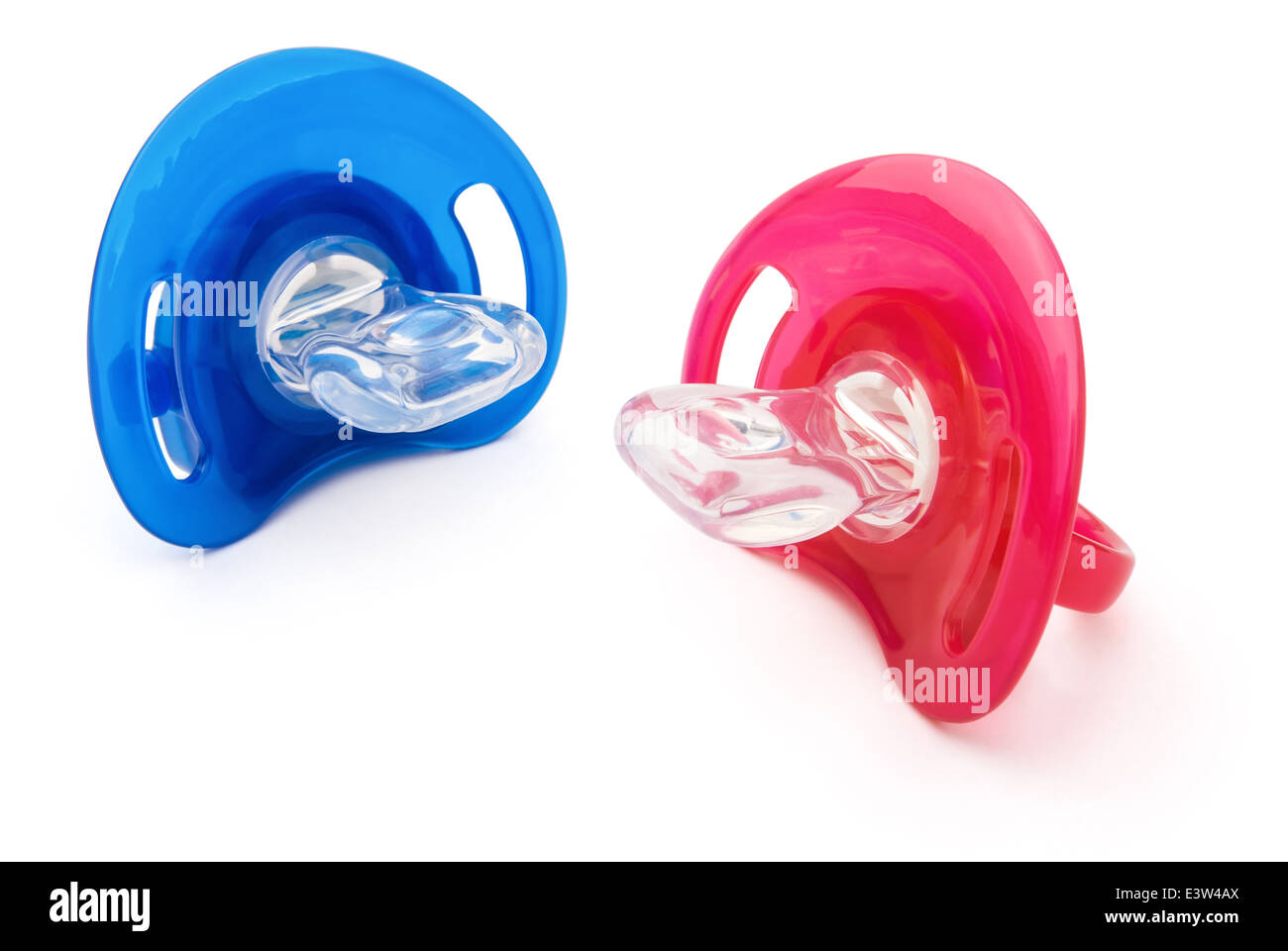 red and blue pacifiers isolated on white with clipping path Stock Photo ...