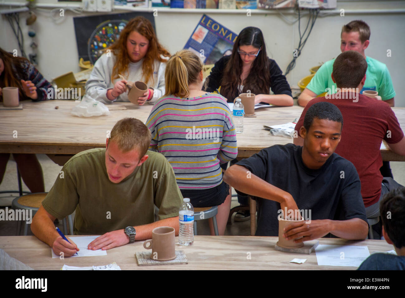 Multiracial high school pottery students in San Clemente, CA, work on ...