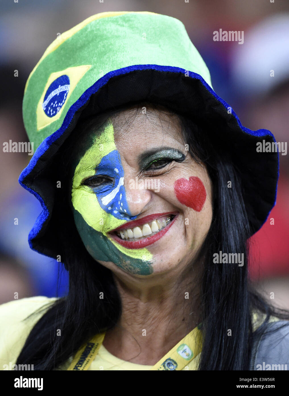 Recife, Brazil. 29th June, 2014. A football fan poses before a Round of ...