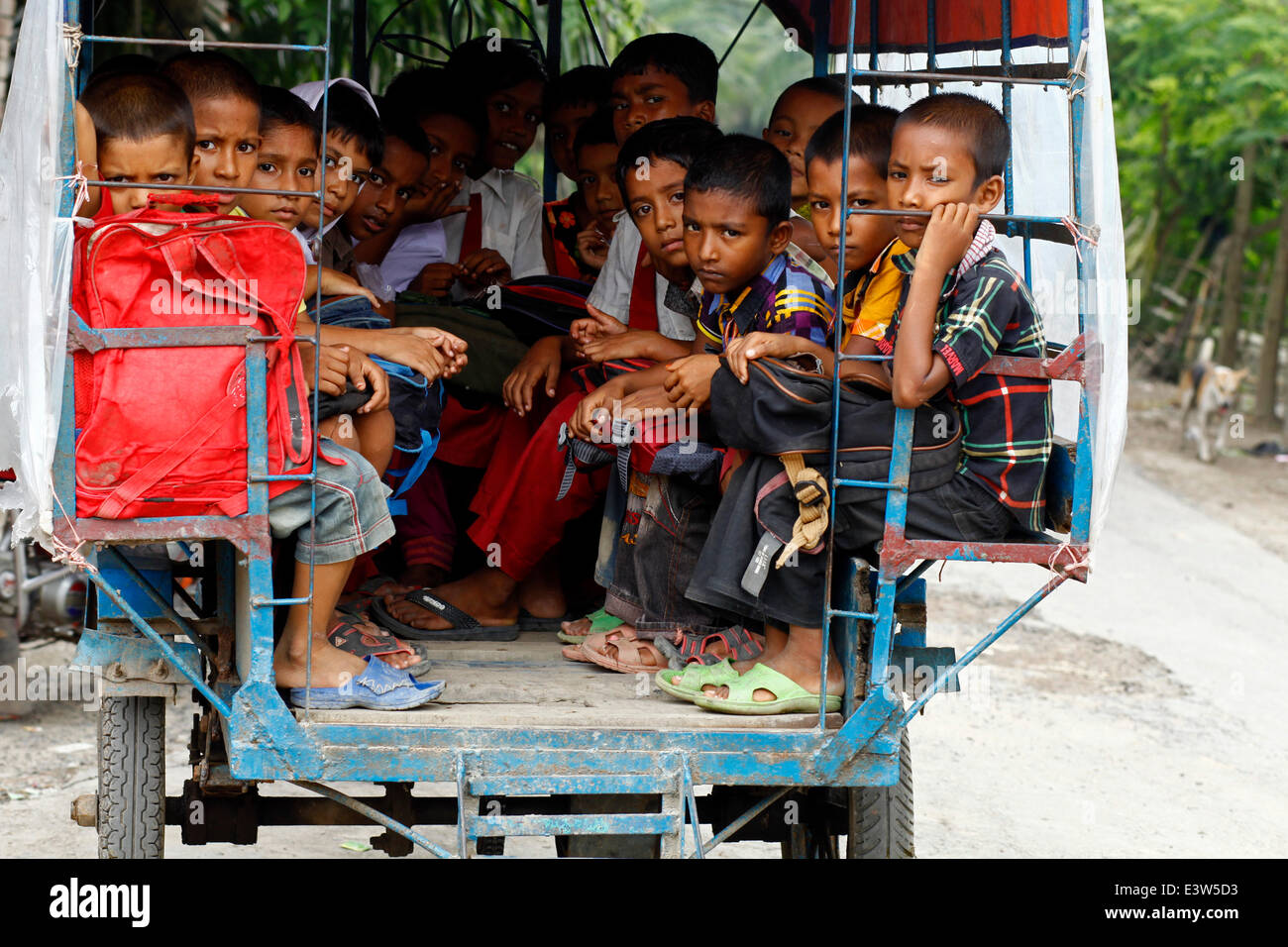 Schoold children back home after school by school van.Primary education ...