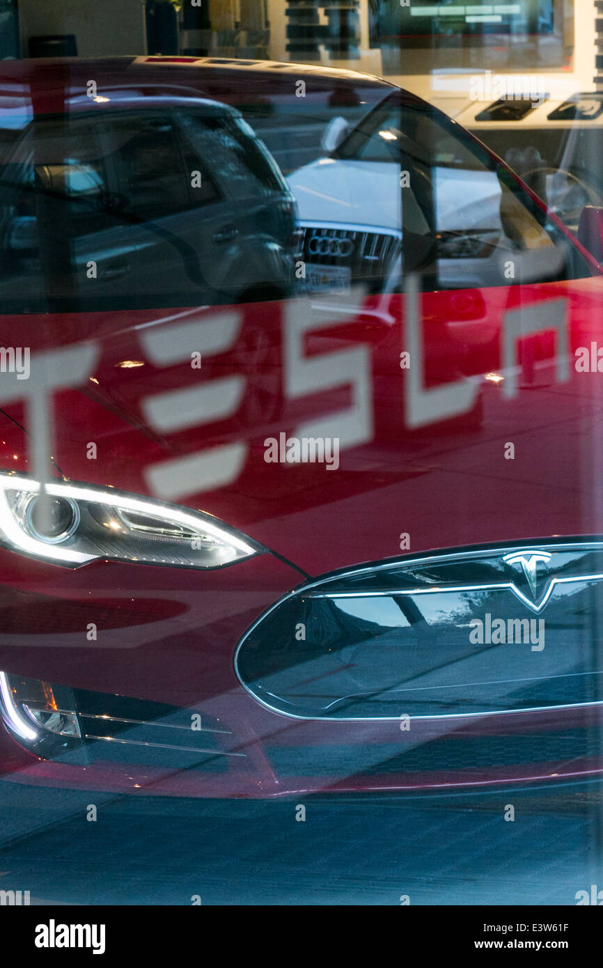 A Tesla Model S electric car is seen through the window of the downtown ...