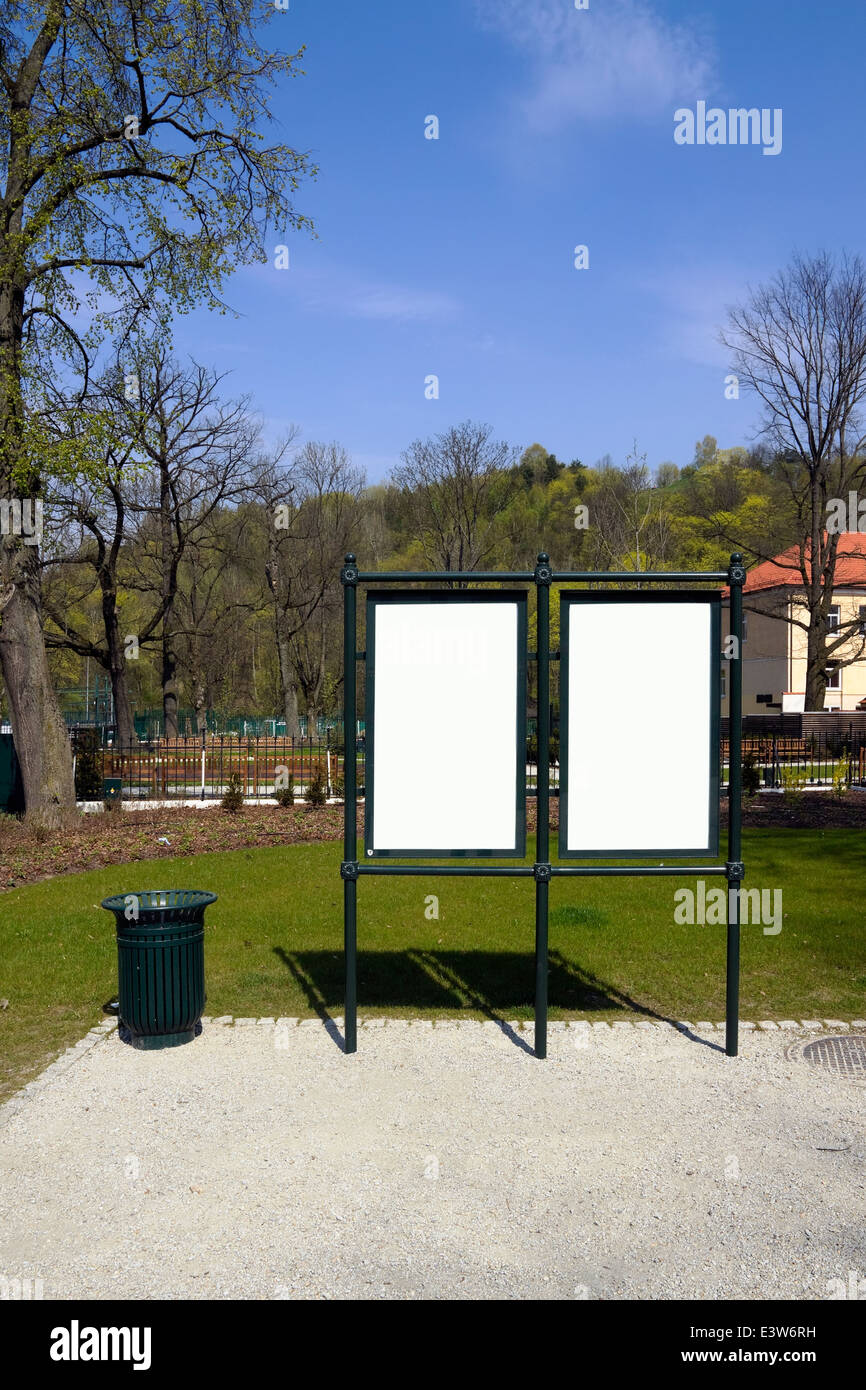 Old retro style iron billboards in spring city park. Sunny day. Mass ...