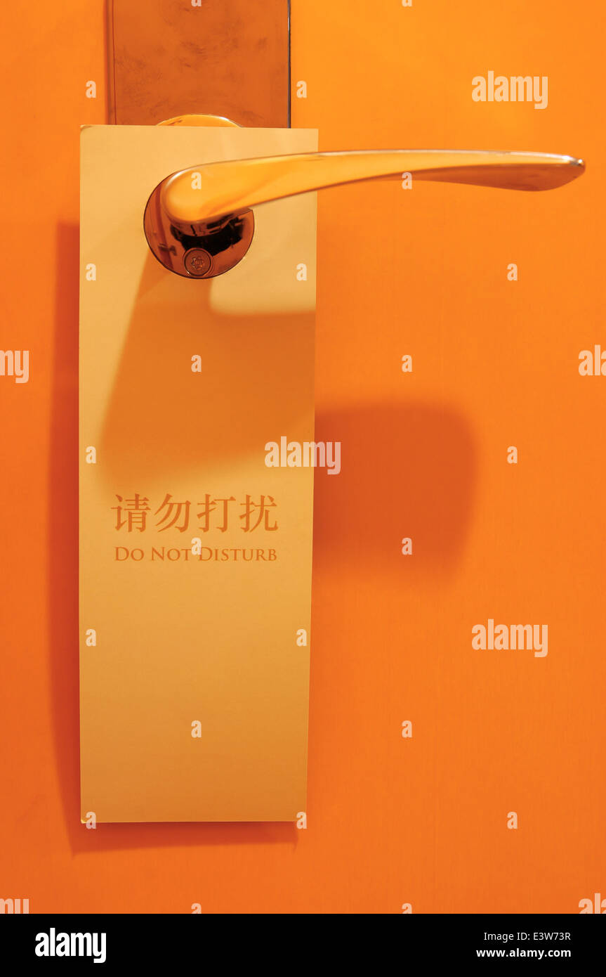 sign of do not disturb hanging Stock Photo - Alamy