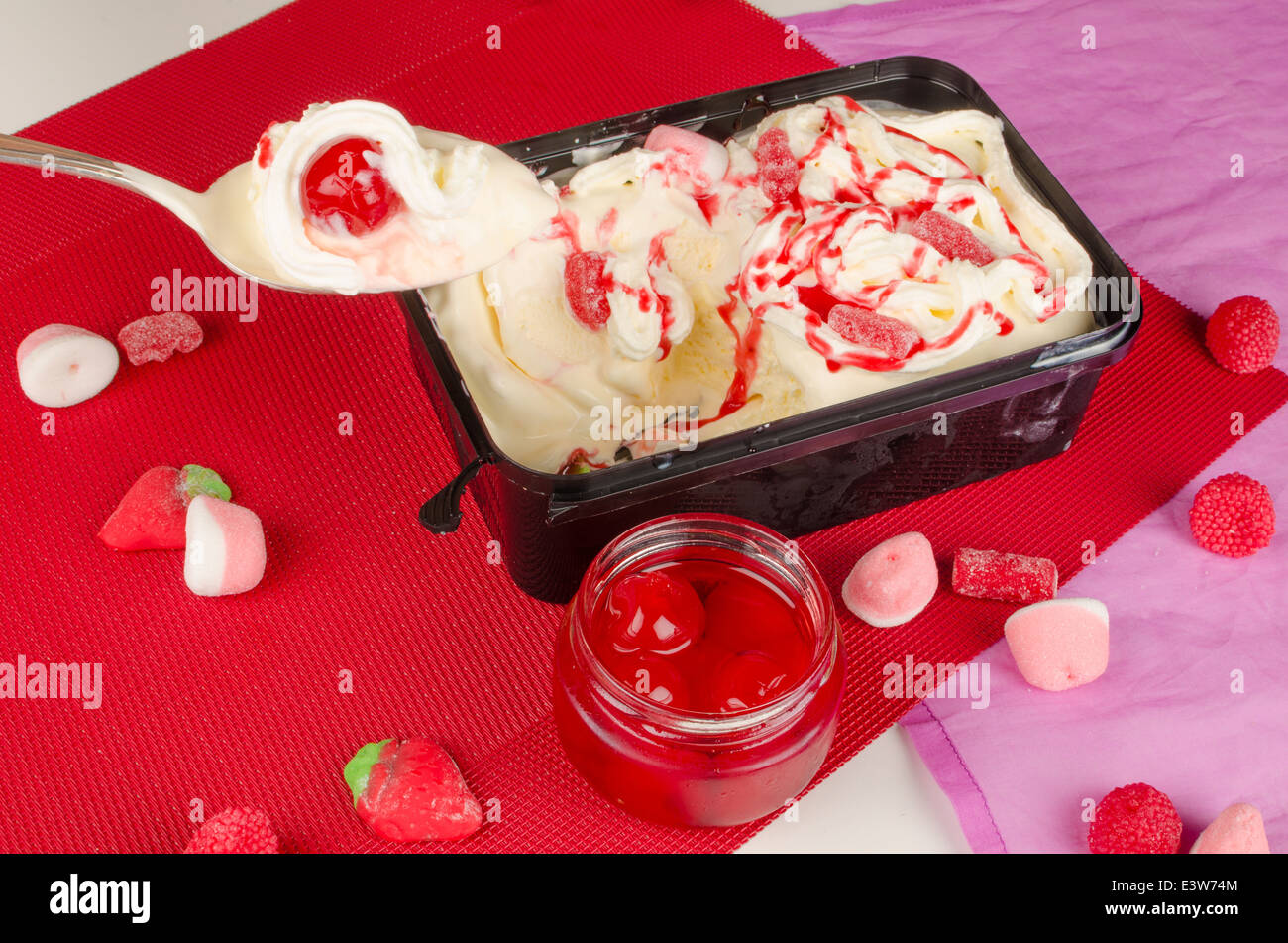 Lots of cream on top of a portion of cloying ice cream Stock Photo - Alamy