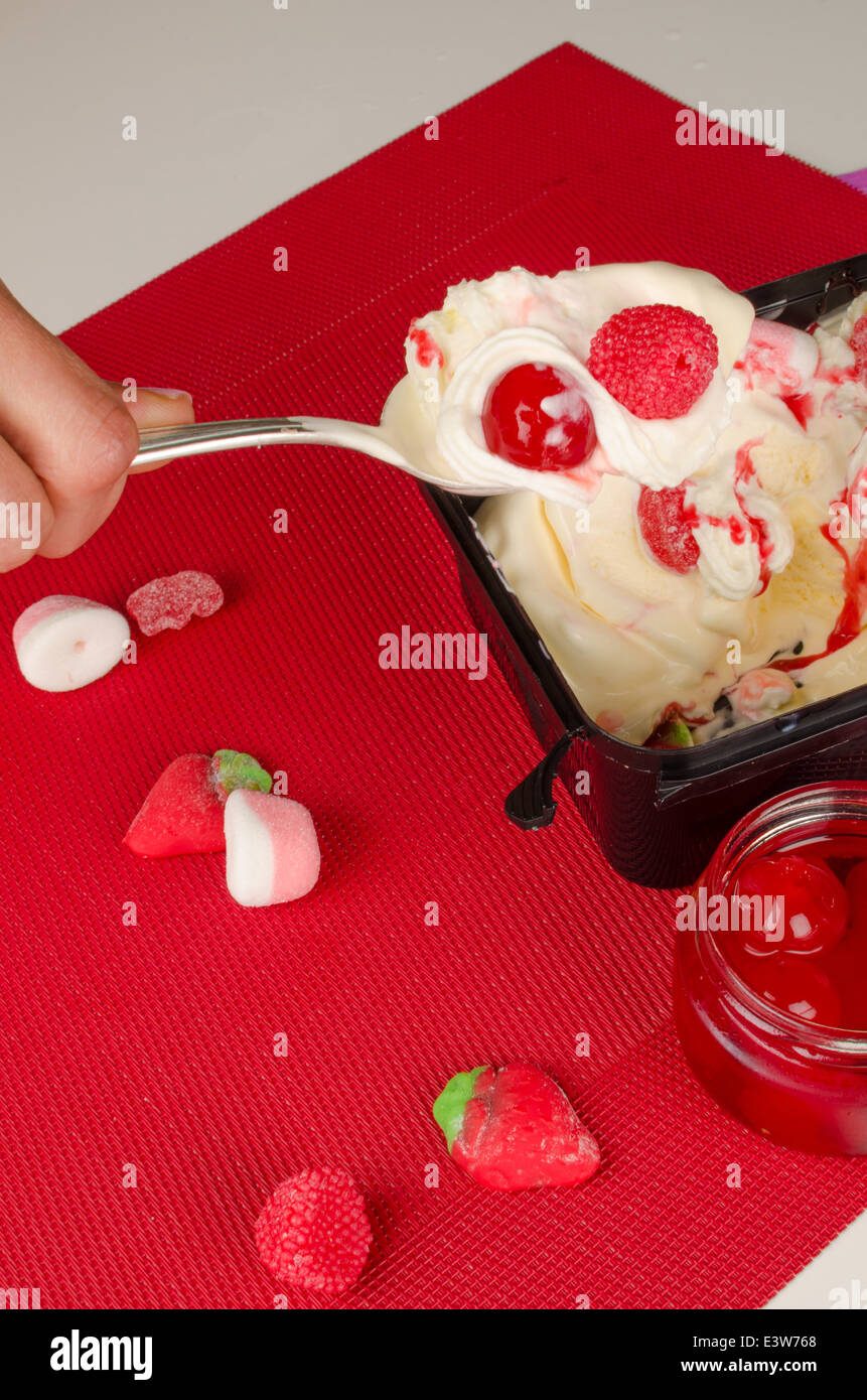 Lots of cream on top of a portion of cloying ice cream Stock Photo - Alamy